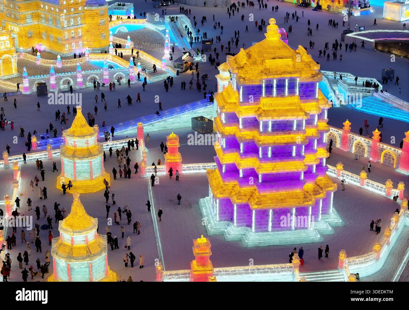 Tourists visit the Harbin Ice and Snow World during the peak ice-snow ...
