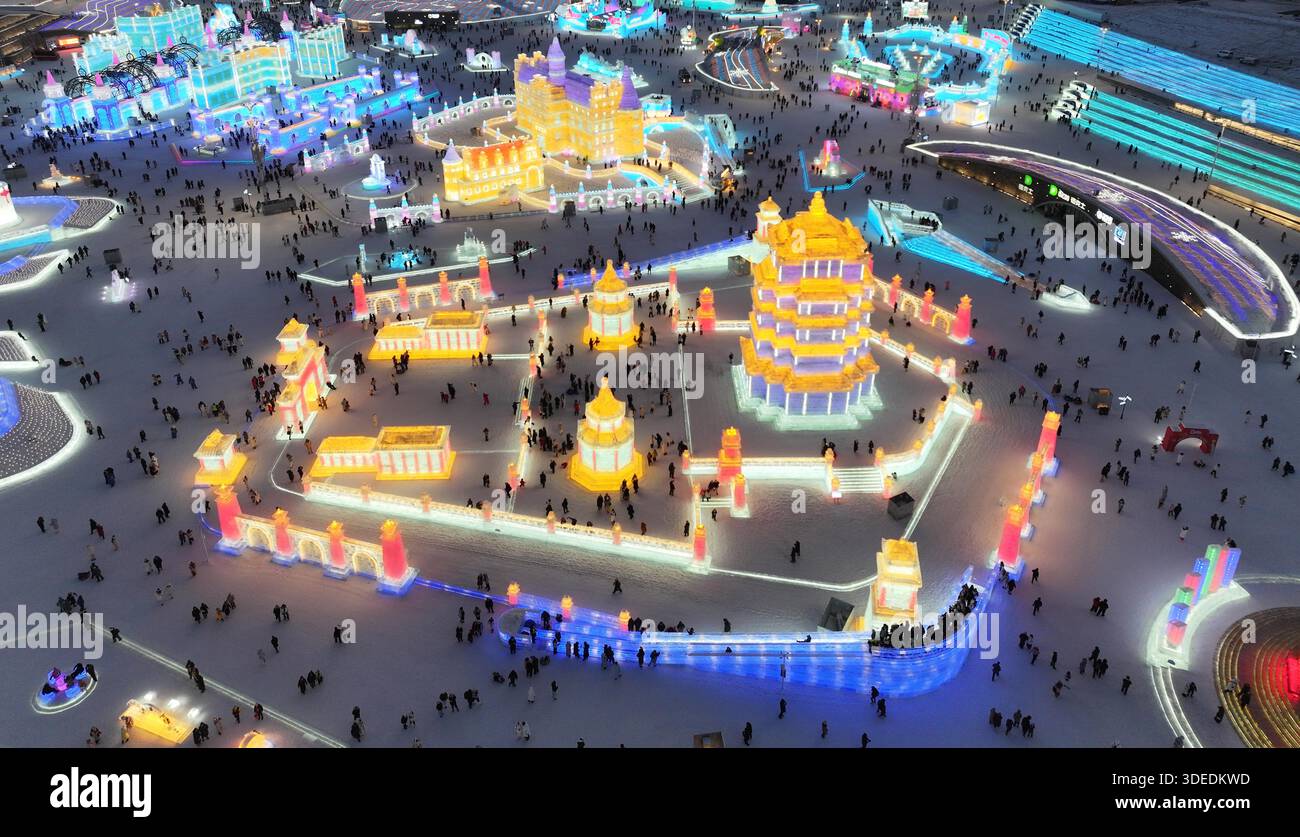 Tourists visit the Harbin Ice and Snow World during the peak ice-snow ...