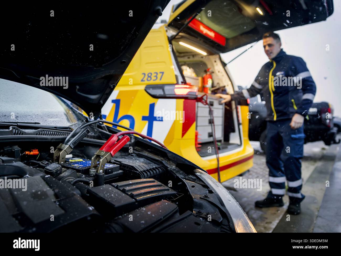 EGMOND AAN ZEE - An ANWB roadside assistance worker attends to a ...
