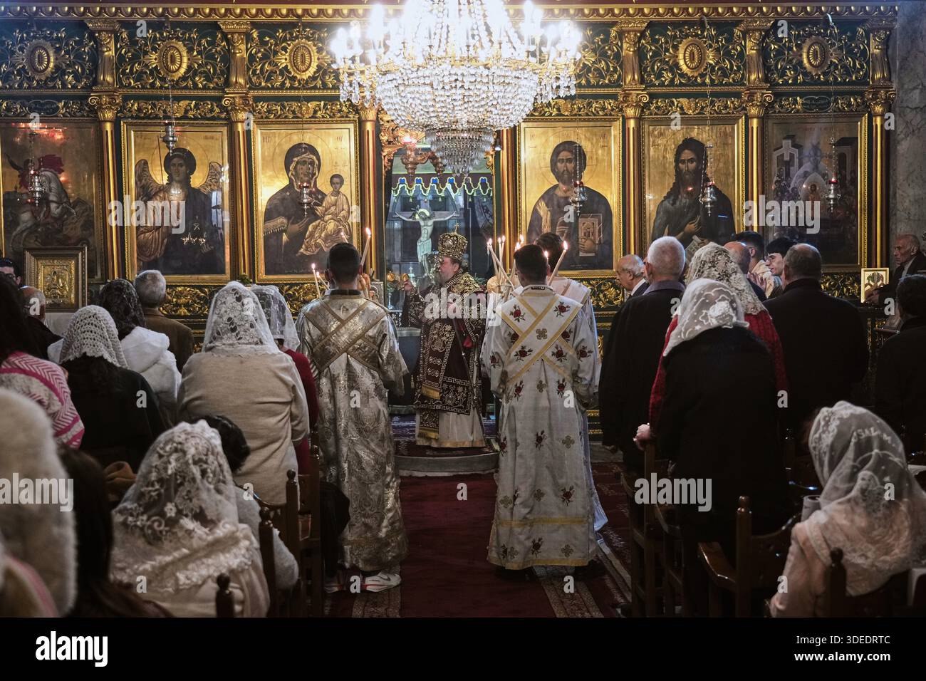Palestinian Orthodox worshippers attend Christmas Mass at the Orthodox ...