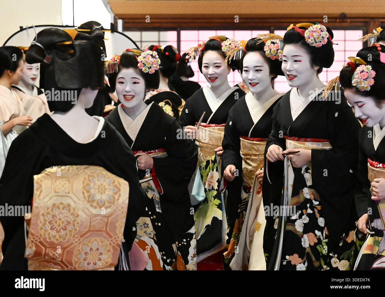 Geiko and Maiko exchange New Year's greetings during an annual opening ...