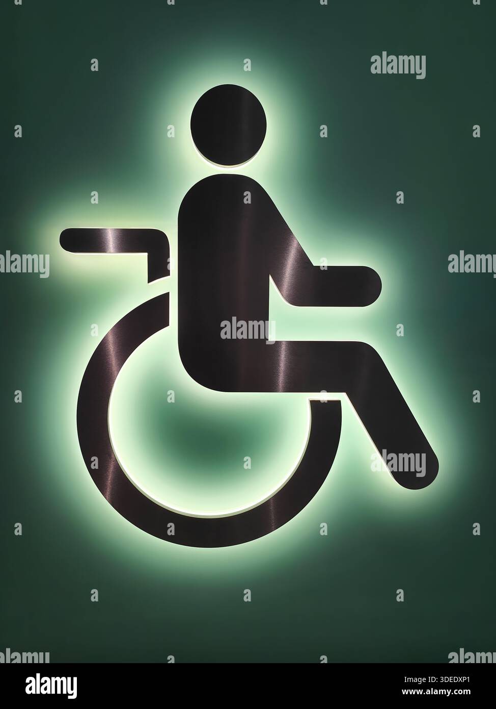 Wheelchair accessibility symbol with illuminated green background ...