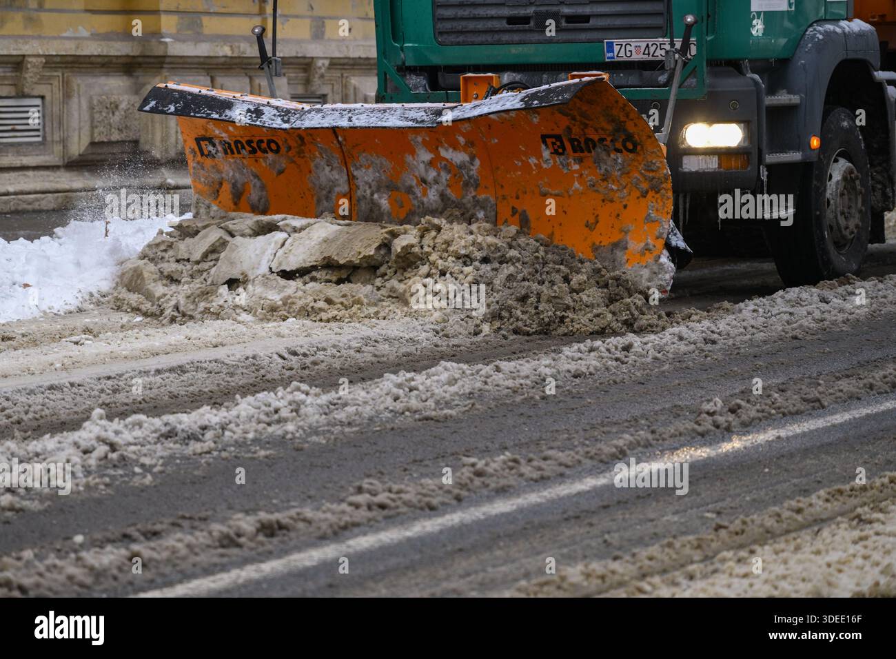 A snowplow clears snow on a road in Zagreb, Croatia, on January 7, 2026 ...