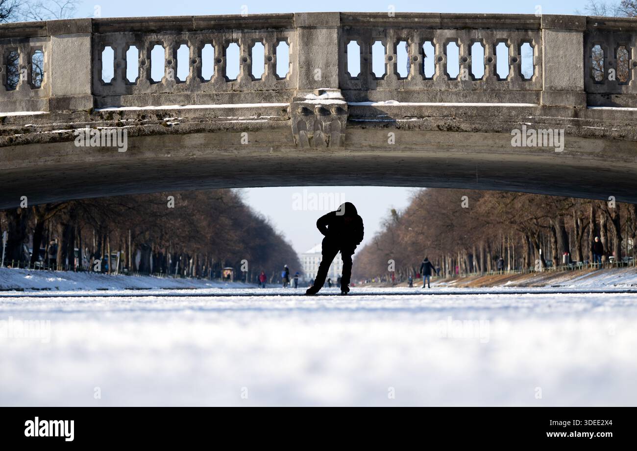 dpatop - 07 January 2026, Bavaria, Munich: A man skates across the ...