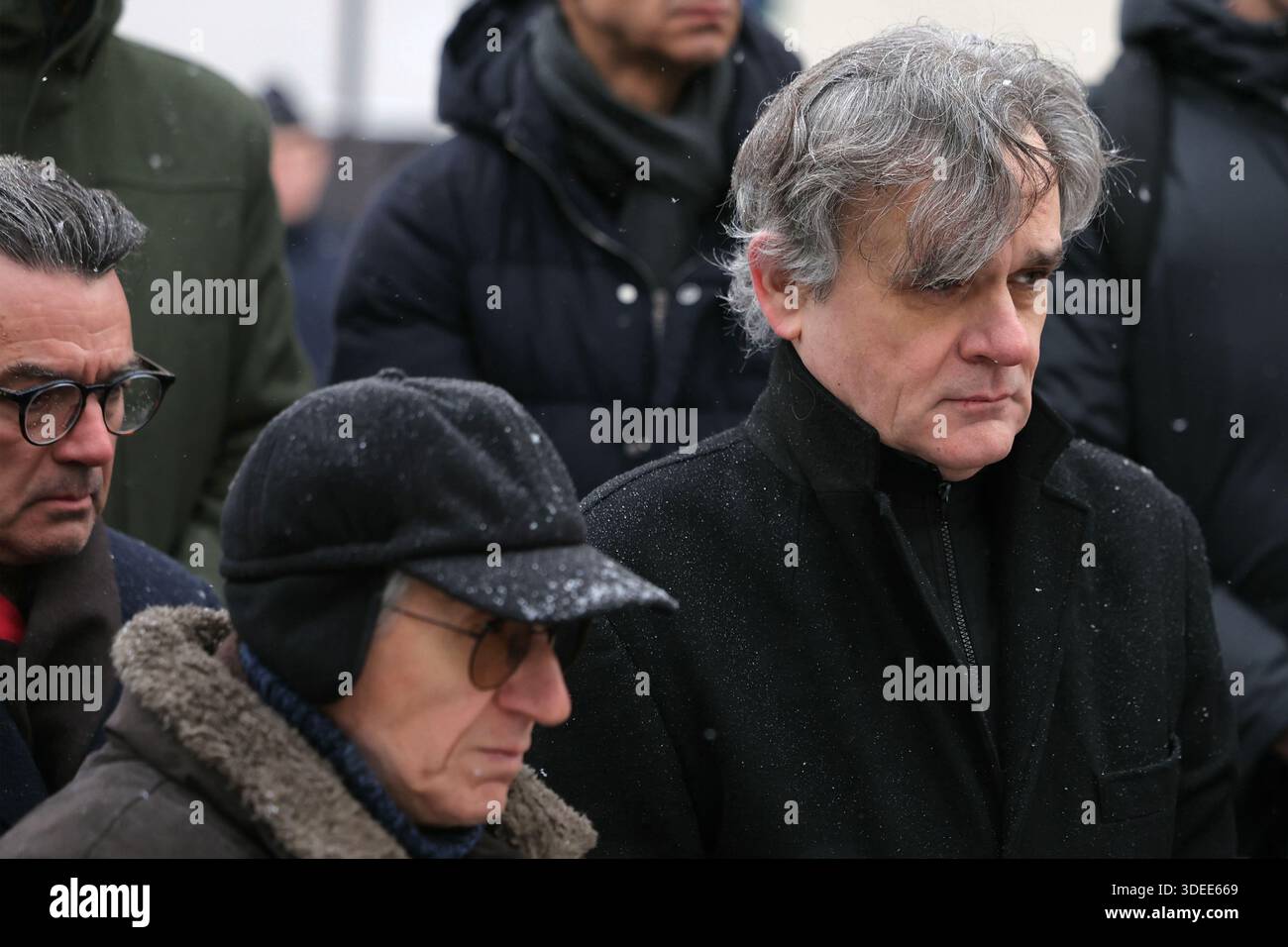 French cartoonist Laurent Sourisseau, known as Riss, right, stands at ...