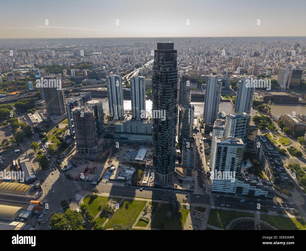 Aerial view of modern skyscrapers pierce the sky, casting long shadows ...