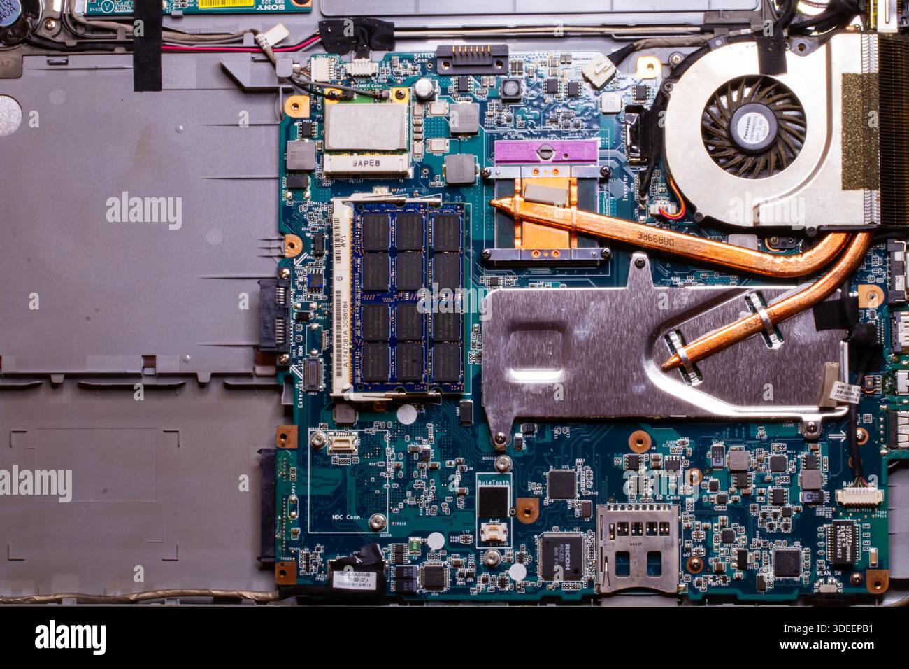 Laptop motherboard featuring installed RAM modules processor unit and ...