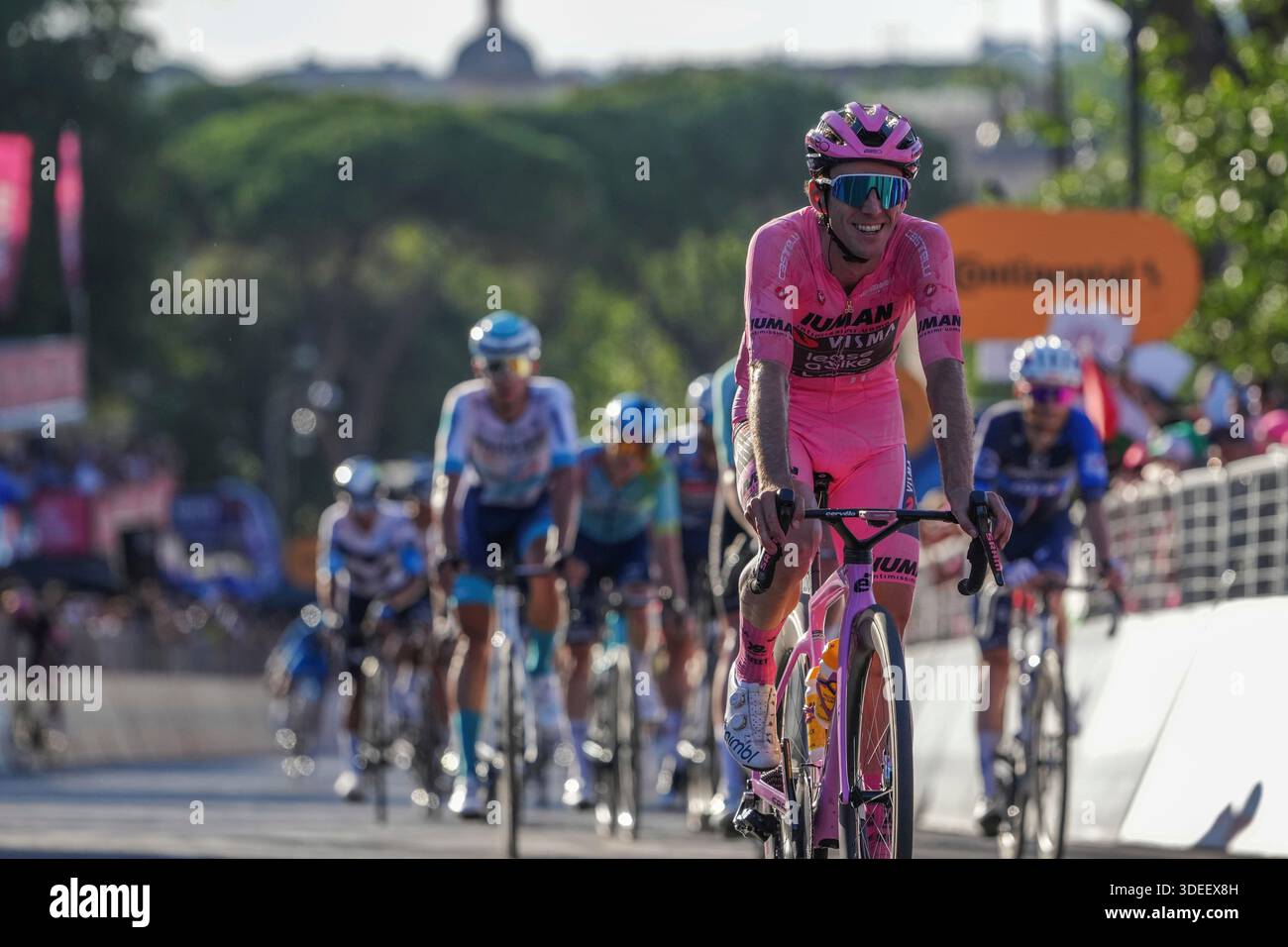 FILE - Britain's Simon Yates wears the pink jersey of the overall ...
