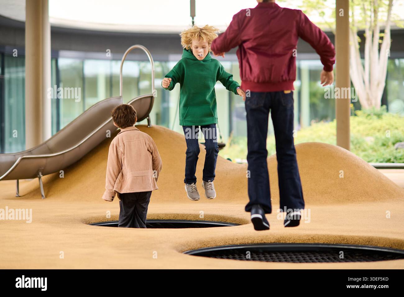 Two kids jump happily hi-res stock photography and images - Alamy