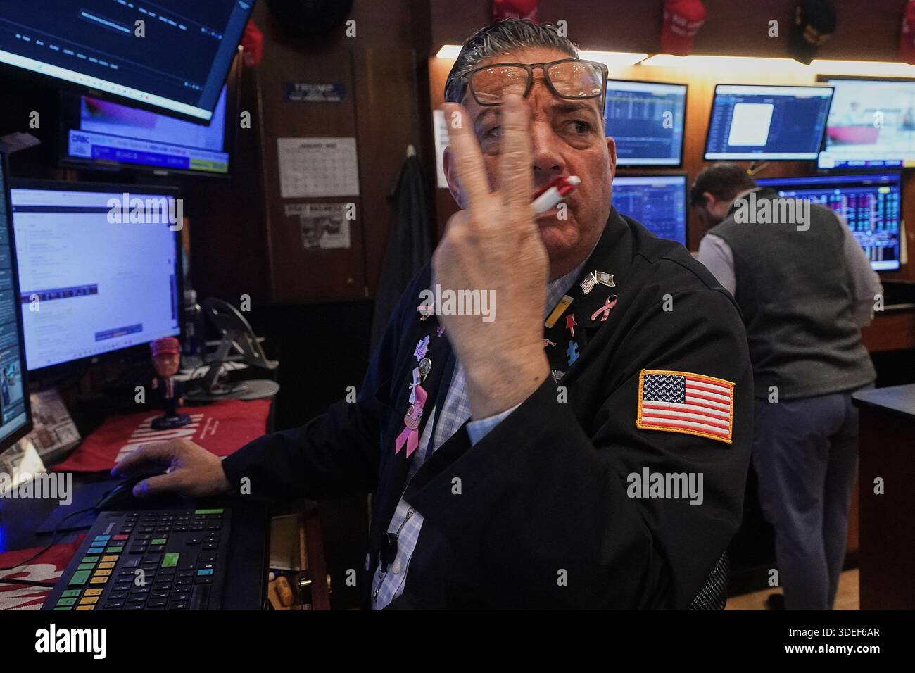 Trader Jonathan Mueller works on the floor of the New York Stock ...