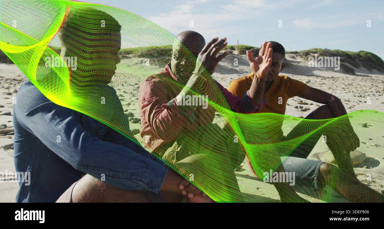 Sitting three men chatting on sandy beach in casual clothes with denim ...
