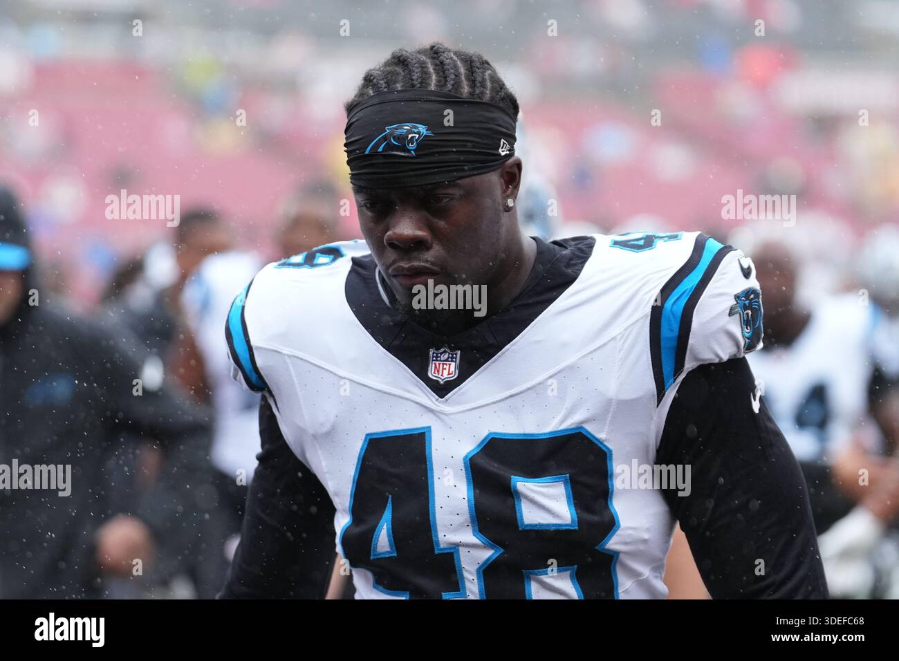 Carolina Panthers linebacker Thomas Incoom (48) enters the locker room ...