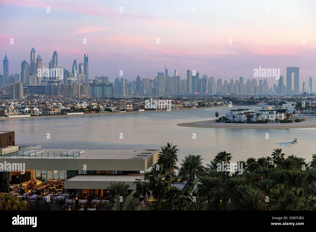 Dubai skyline at sunset seen from Palm Jumeirah, United Arab Emirates ...
