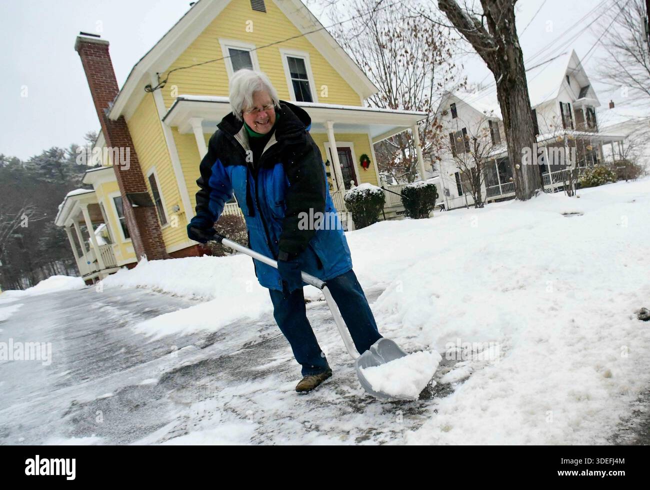 Becky Cameron of Brattleboro, Vt., shovels after a wintry mess created ...