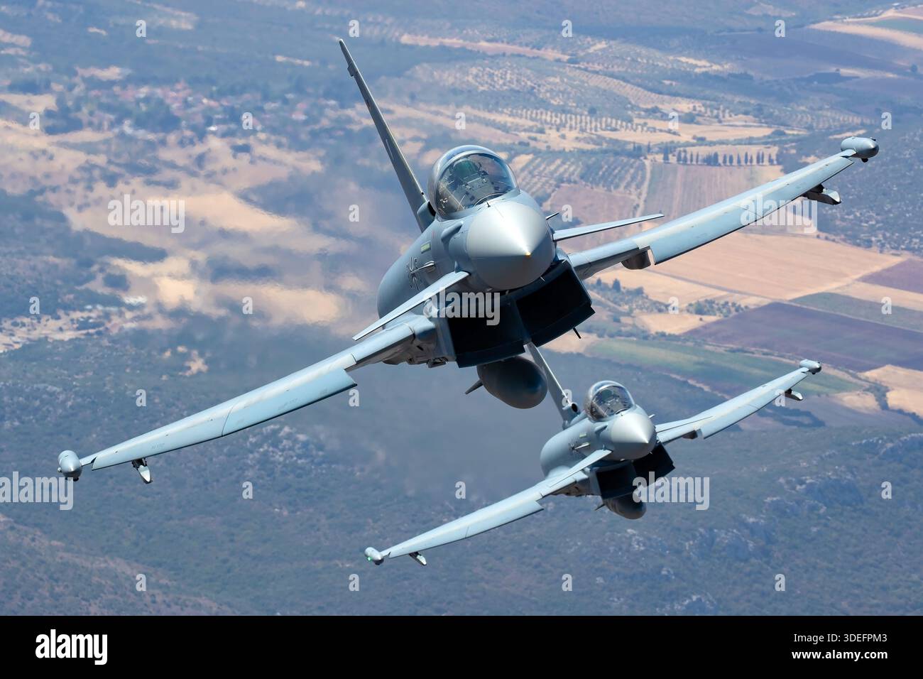 Two Luftwaffe Eurofighter EF-2000 Typhoon S jets fly in close formation ...