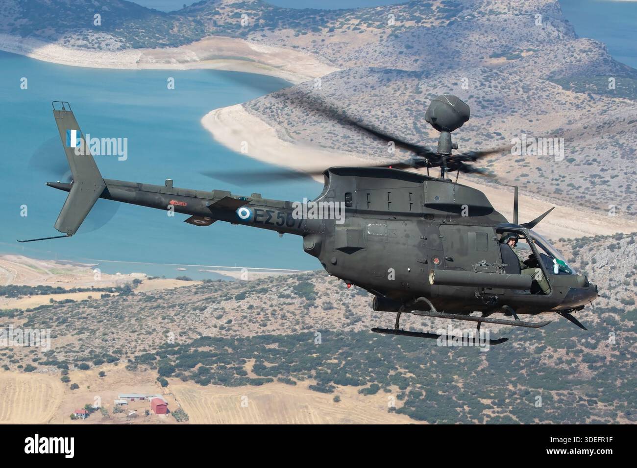 The image shows a Hellenic Army Bell OH-58D Kiowa Warrior helicopter ...