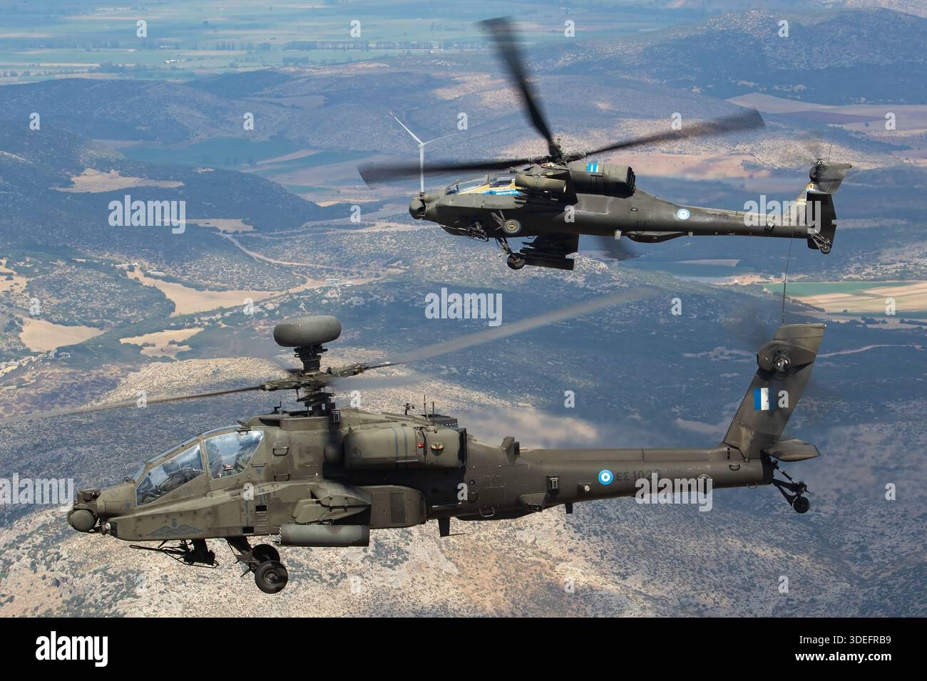 A Greek Army AH-64DHA Apache Longbow is photographed banking in air-to ...