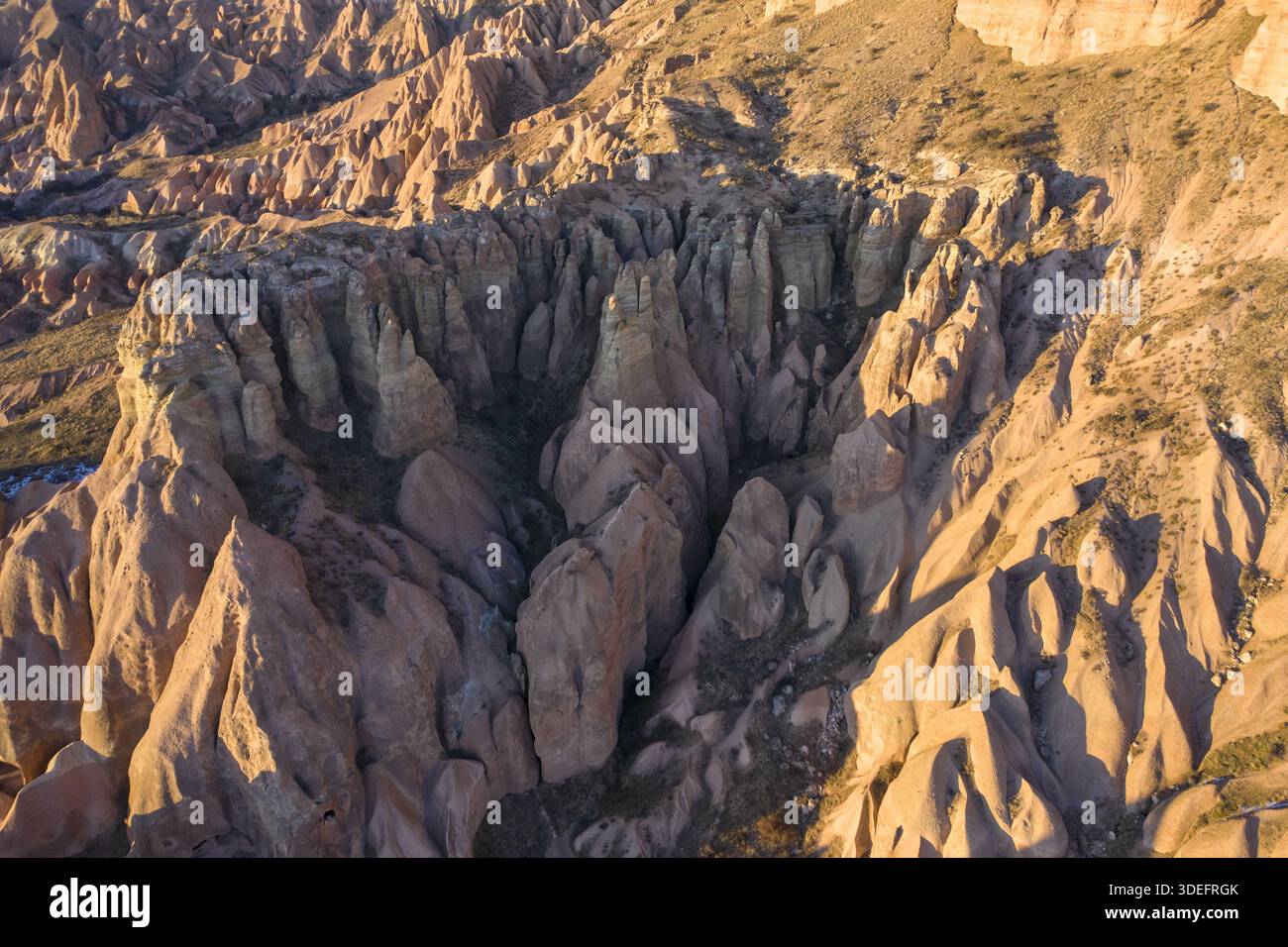 Aerial view of the rugged, sun-kissed landscape of Cappadocia, where ...