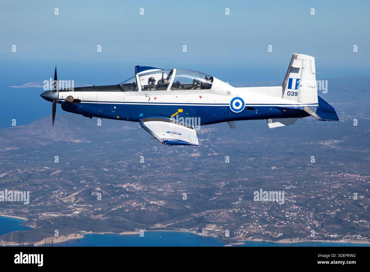 A Greek Air Force Raytheon T-6A Texan II is shown flying air-to-air ...