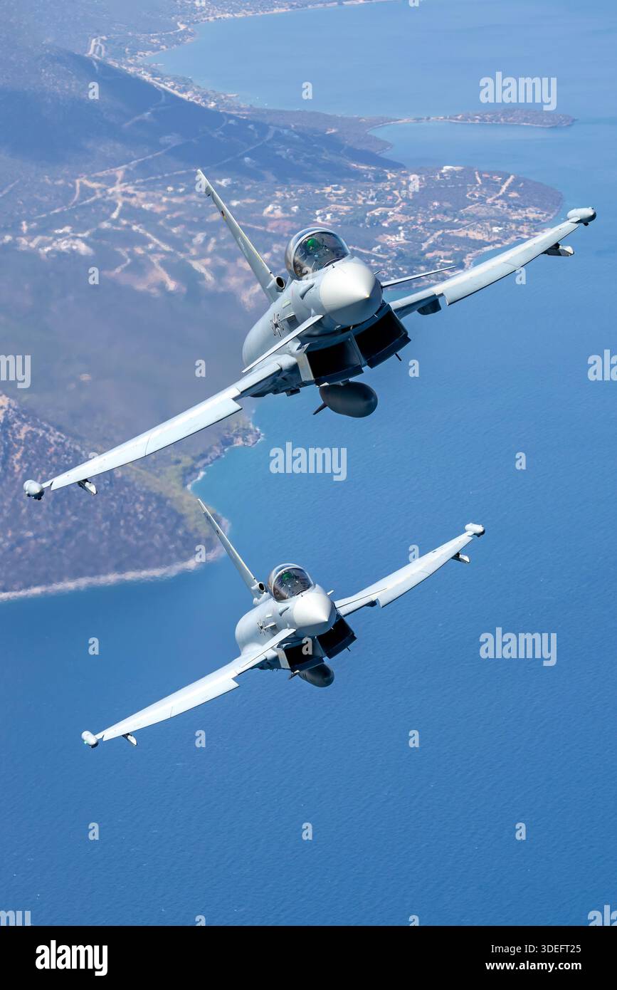 Two Luftwaffe Eurofighter EF-2000 Typhoon S aircraft fly in formation ...