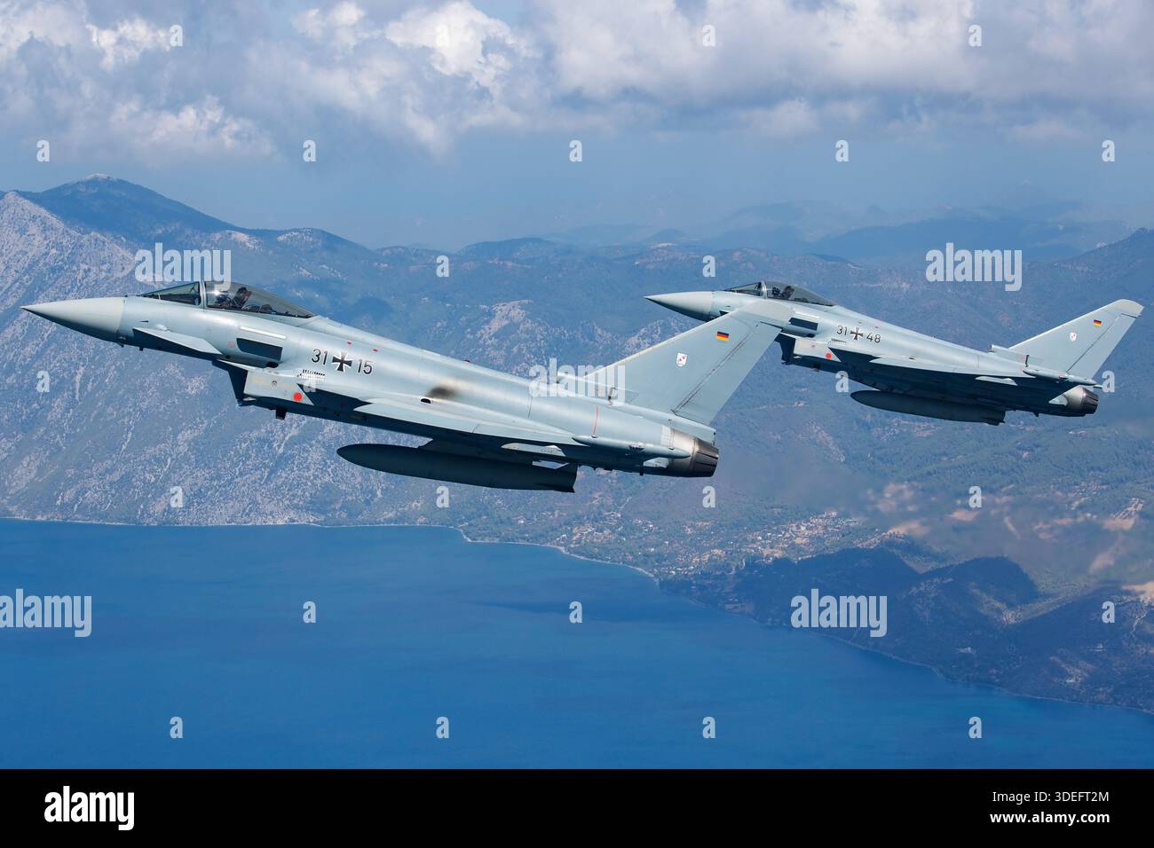 Two Luftwaffe Eurofighter EF-2000 Typhoon S jets fly in formation at ...