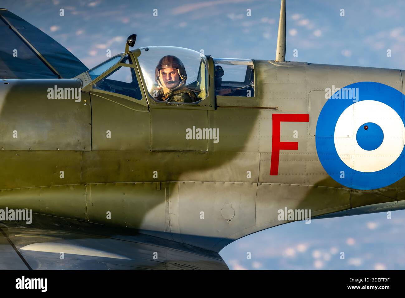 Close-up air-to-air view of the cockpit area of a Supermarine Spitfire ...
