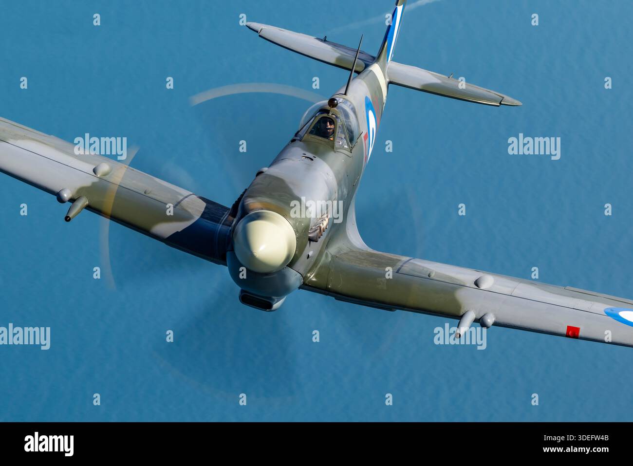 Air-to-air close-up showing the pilot and forward fuselage of ...
