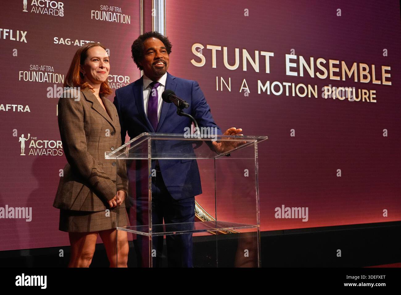 Elizabeth McLaughlin, left, and Jason George present the nominees for ...