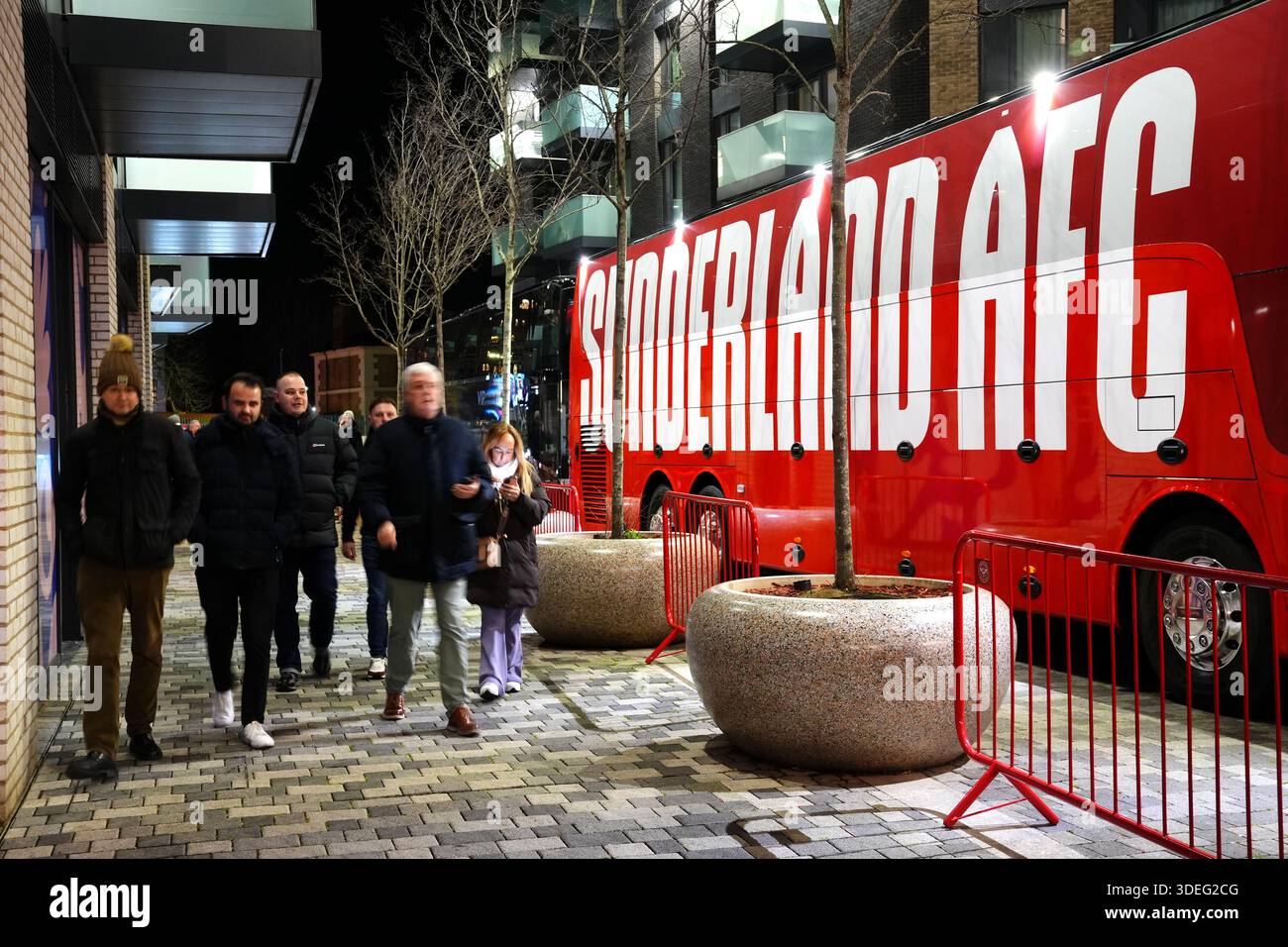 Fans walk past the Sunderland team bus ahead of the Premier League ...