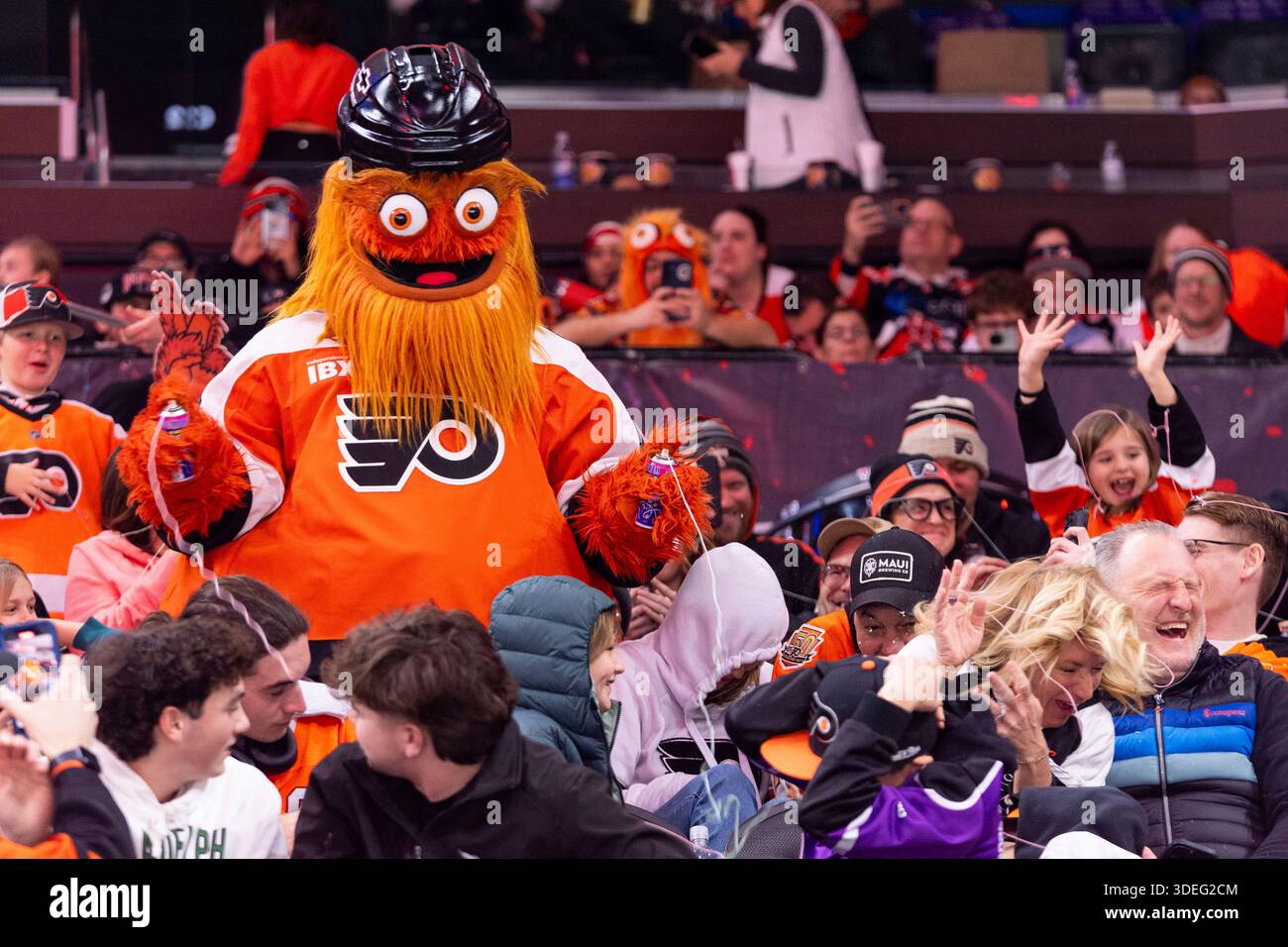 Philadelphia Flyers mascot Gritty sprays silly string onto the fans ...