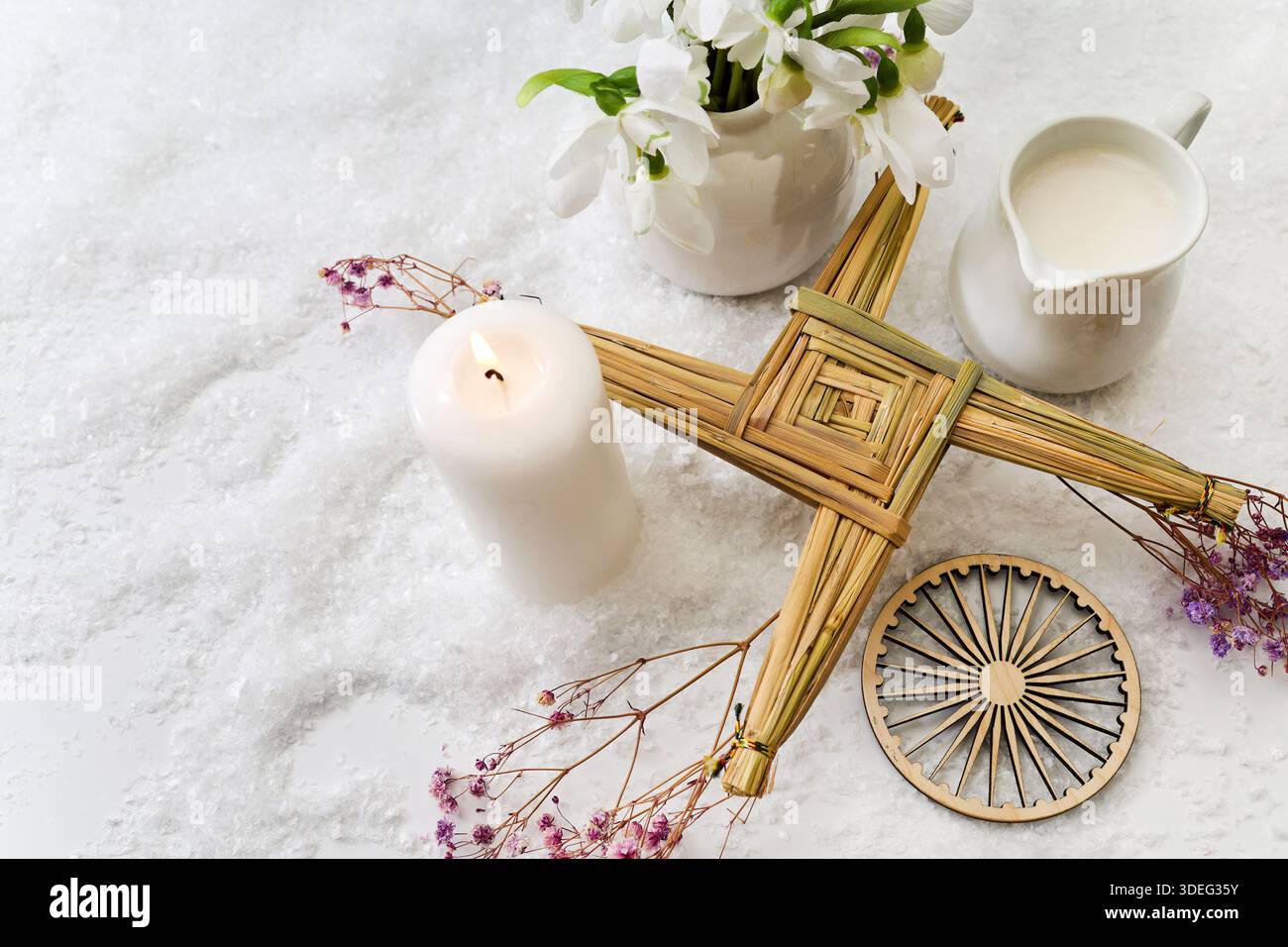 Imbolc altar with brigid's cross, candle, and snowdrops Stock Photo - Alamy