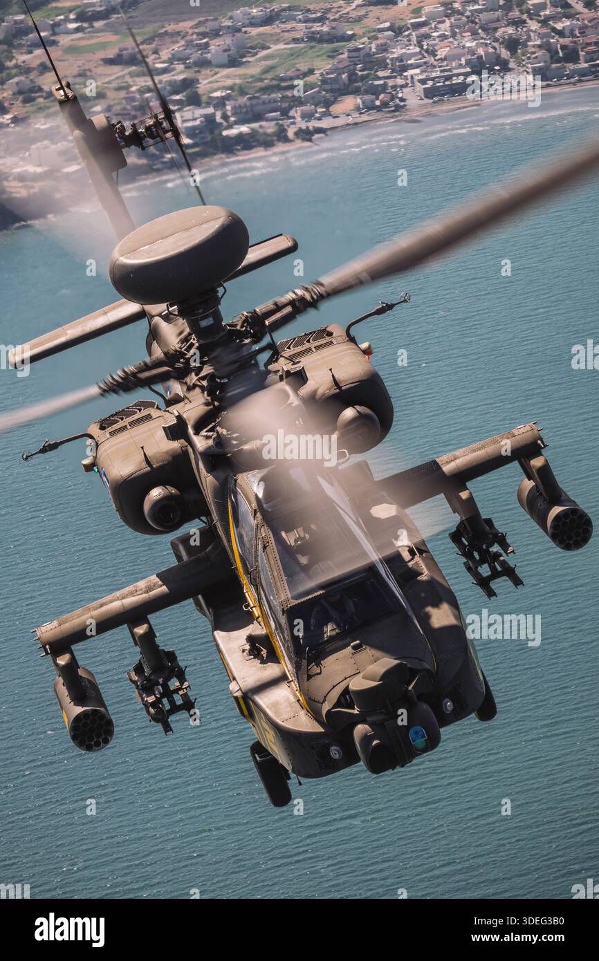 A Hellenic Army Boeing AH-64DHA Apache Longbow is shown in air-to-air ...