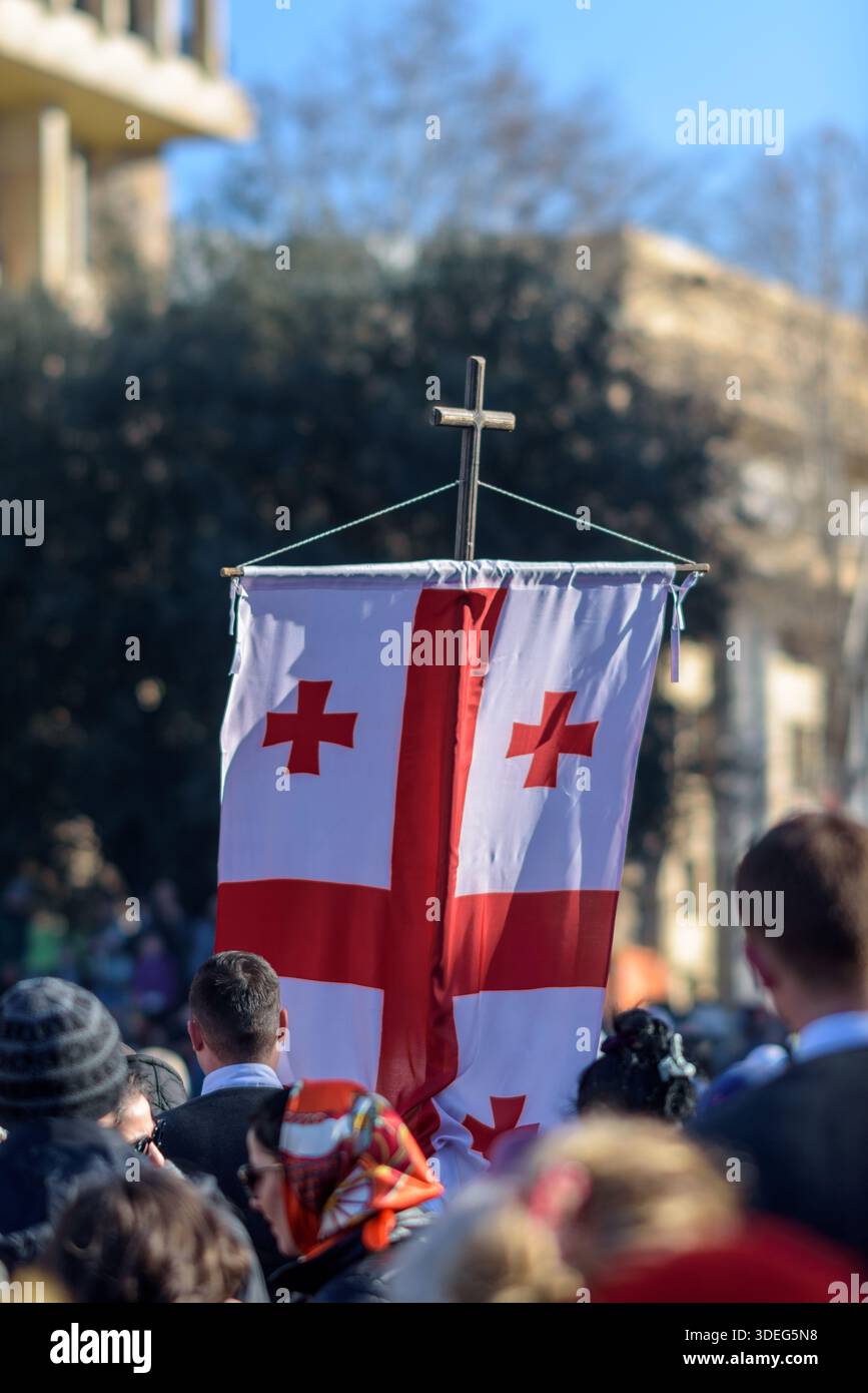 Georgian flag and cross at traditional Alilo Orthodox Christmas ...