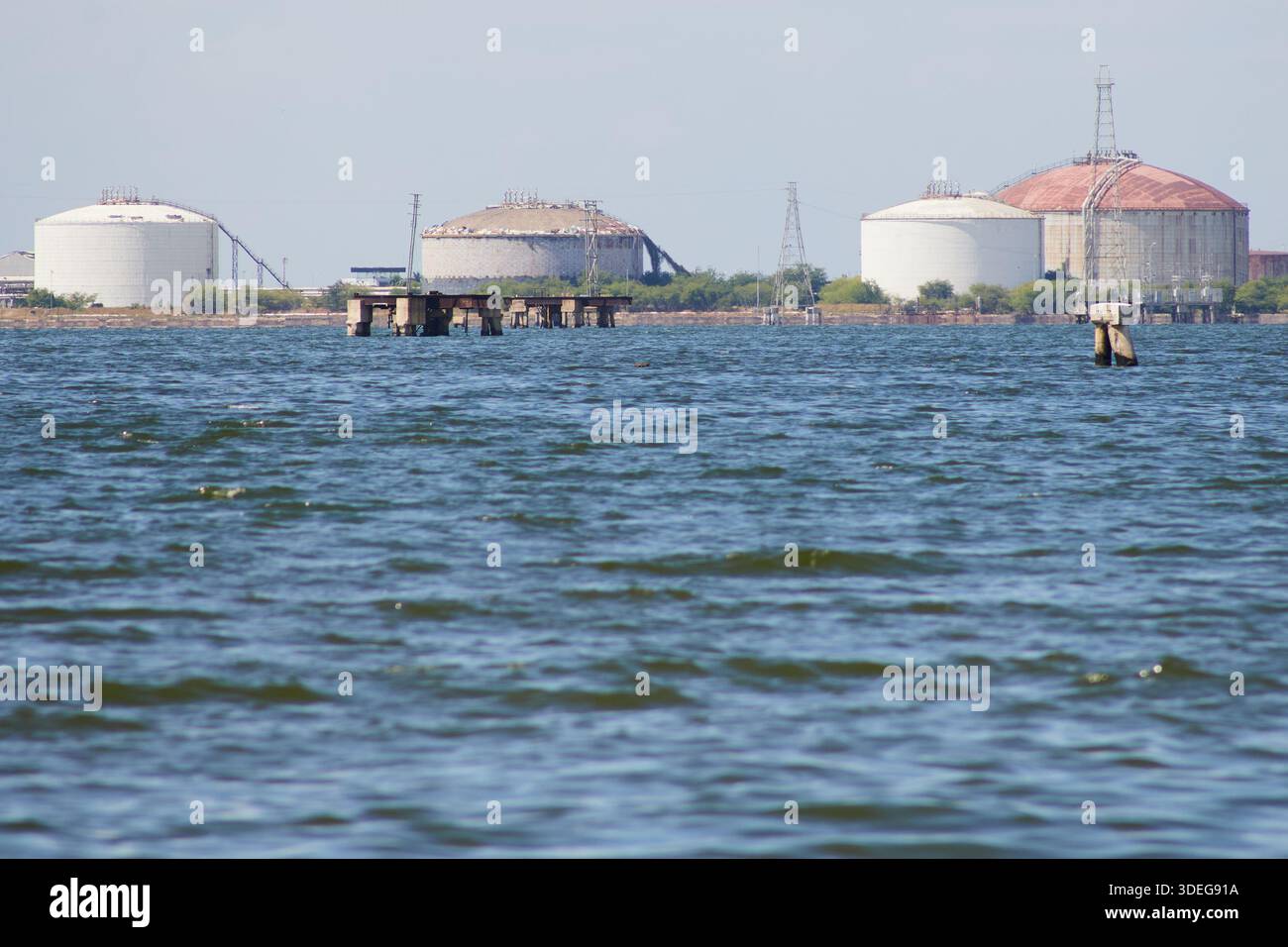 Storage tanks at oil facilities stand on Lake Maracaibo in Cabimas ...