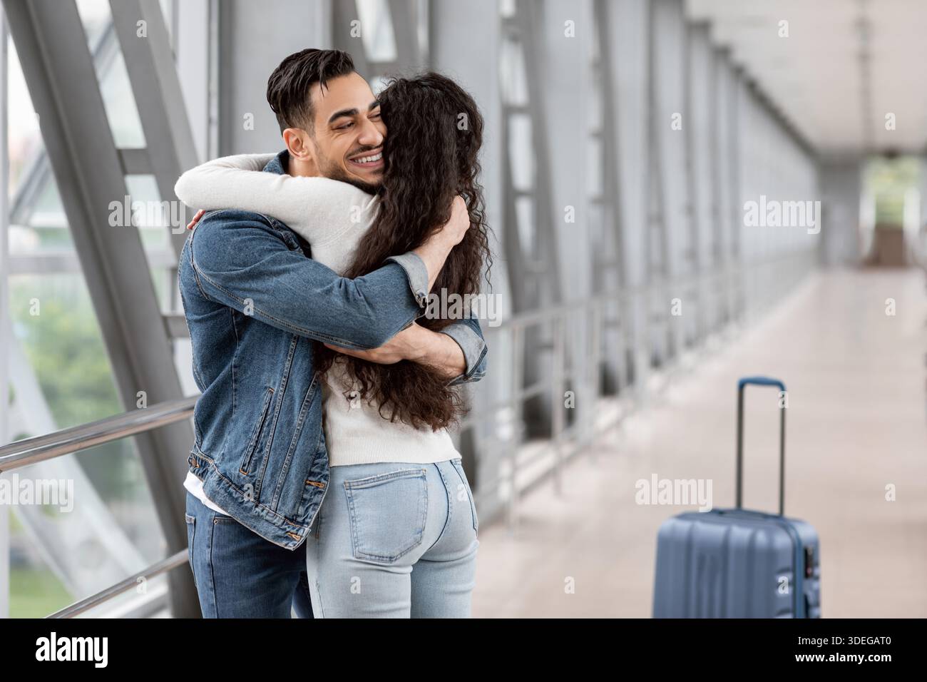 Long Awaited Meet. Happy Arab Man Hugging Girlfriend At Airport After ...