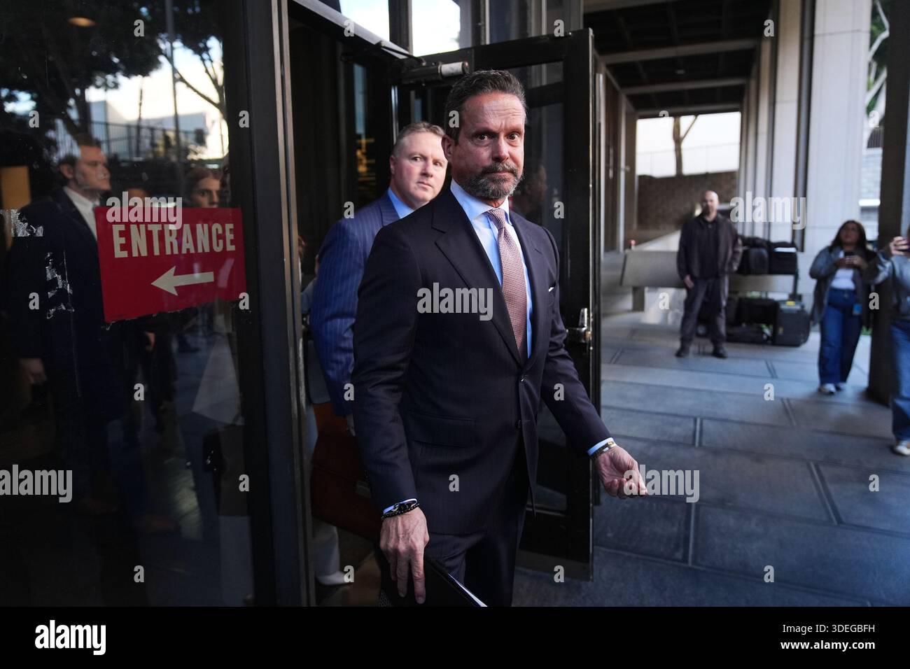 Alan Jackson, the attorney for Nick Reiner, leaves court after Reiner's ...