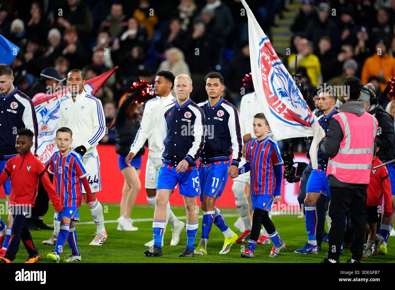 Crystal Palace's Brennan Johnson (centre) and players walk onto the ...