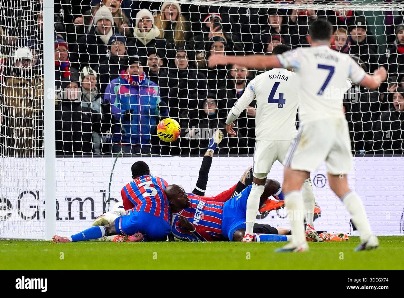 Crystal Palace's Tyrick Mitchell (left) attempts a headed shot towards ...