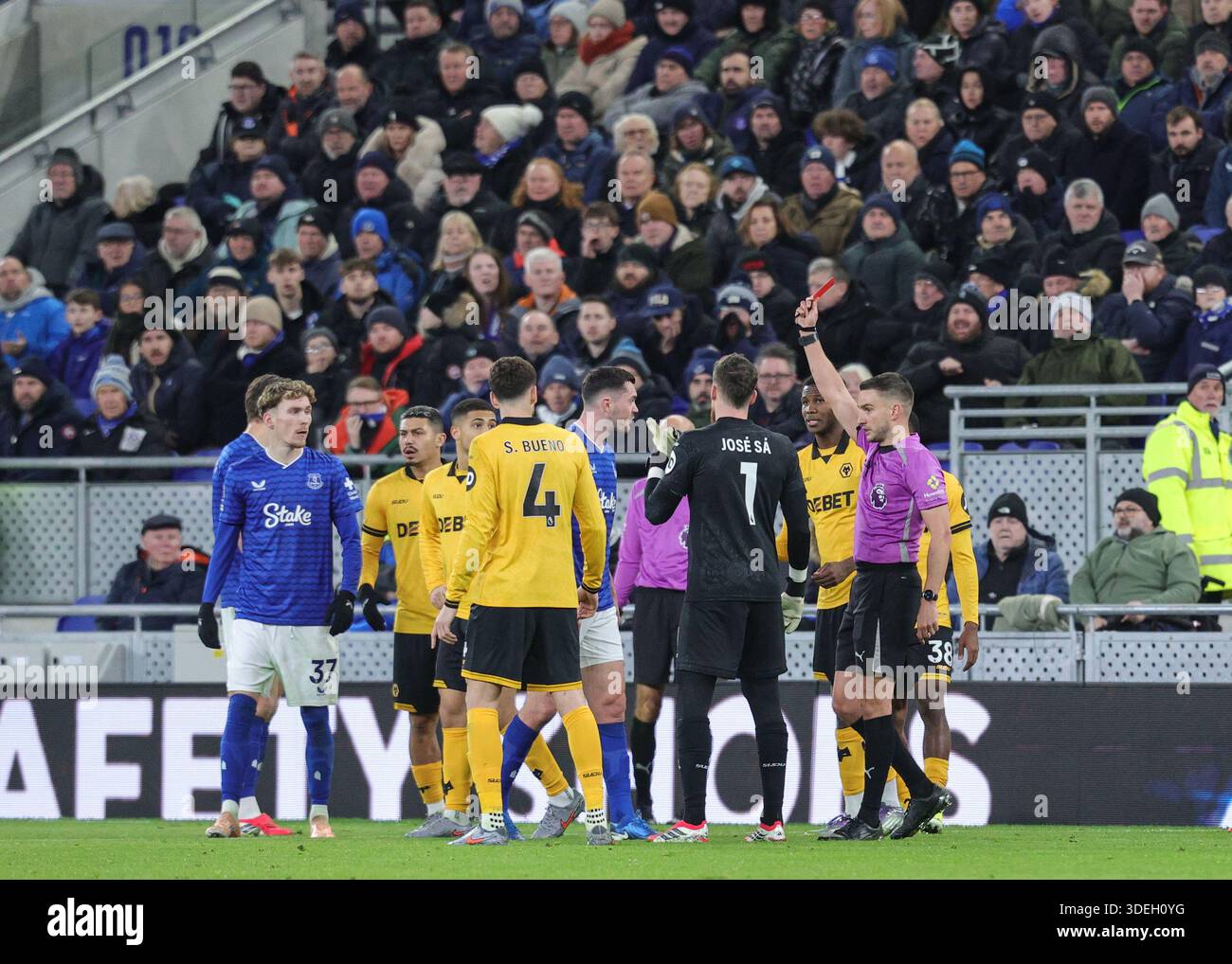 referee Thomas Kirk gives a red card to Michael Keane of Everton during ...