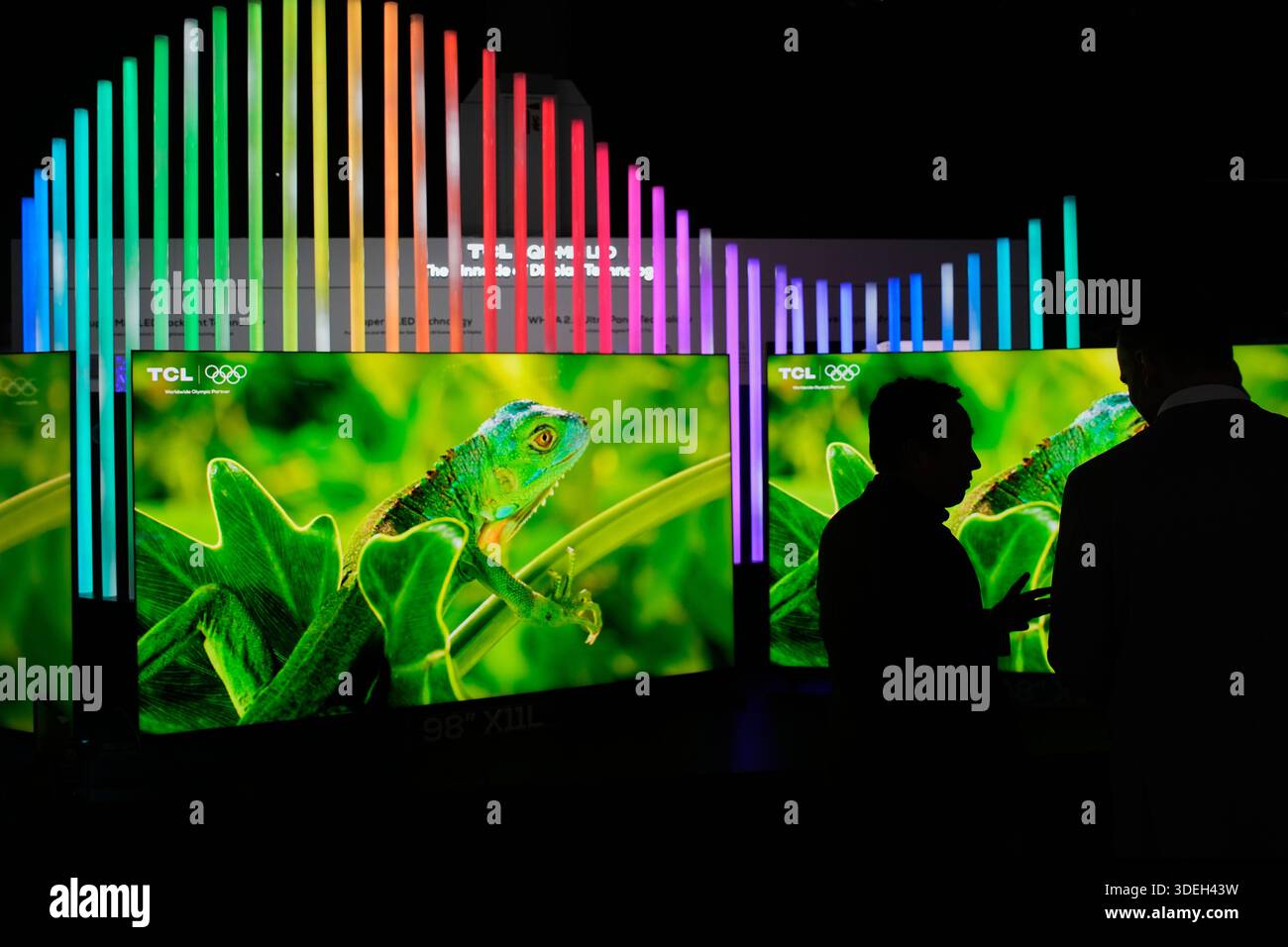 People watch the SQD Mini LED TV on display at the TCL booth during the ...