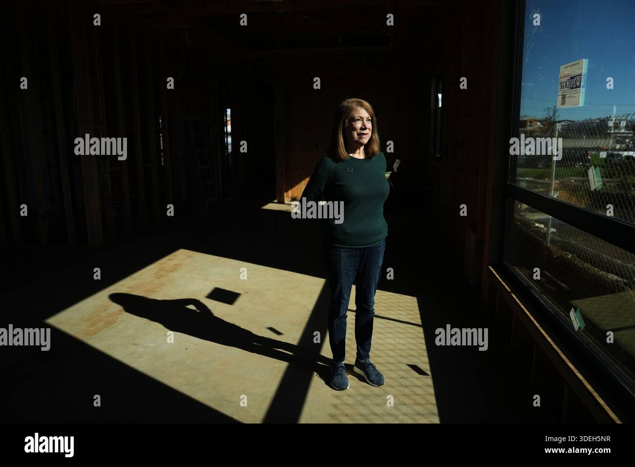 Gail Kass stands inside her home being rebuilt on the one-year ...