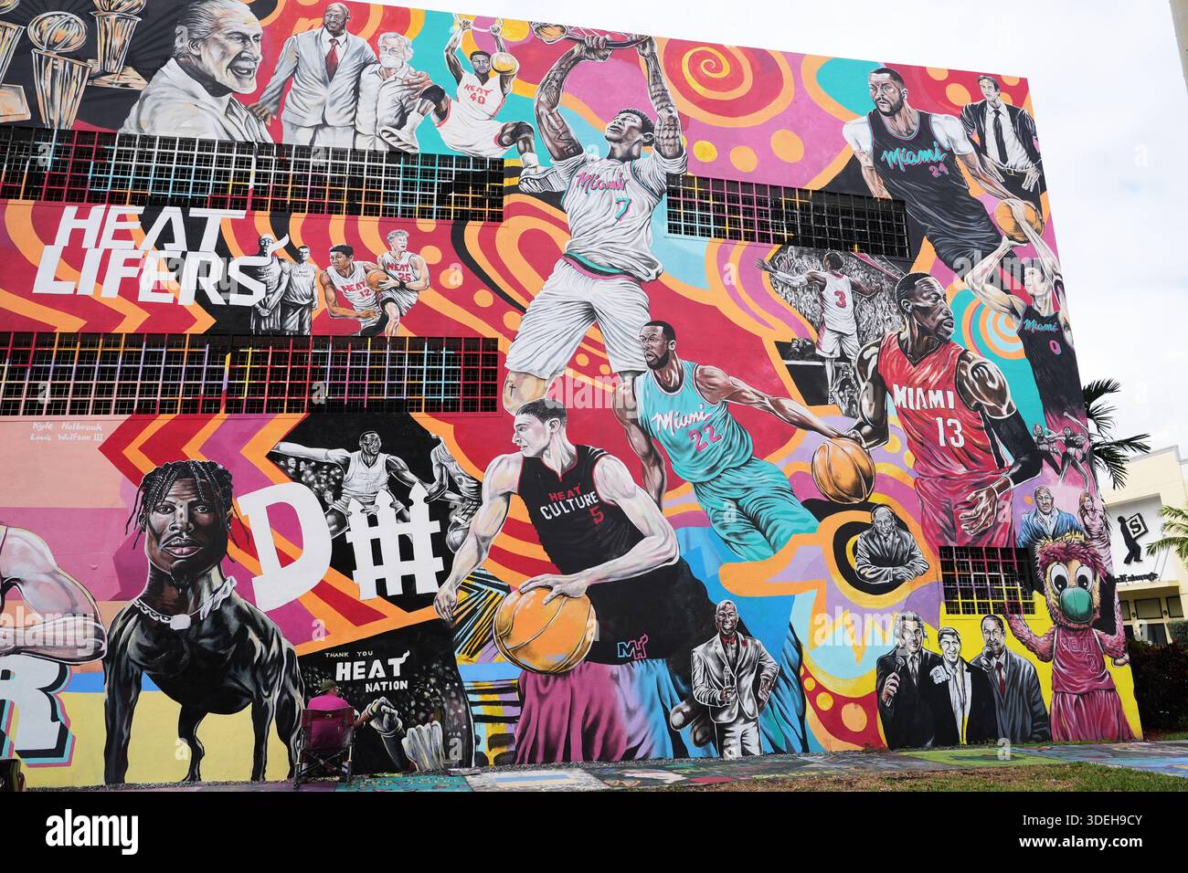 Artist Kyle Holbrook, lower left, works on his Miami Heat mural ...