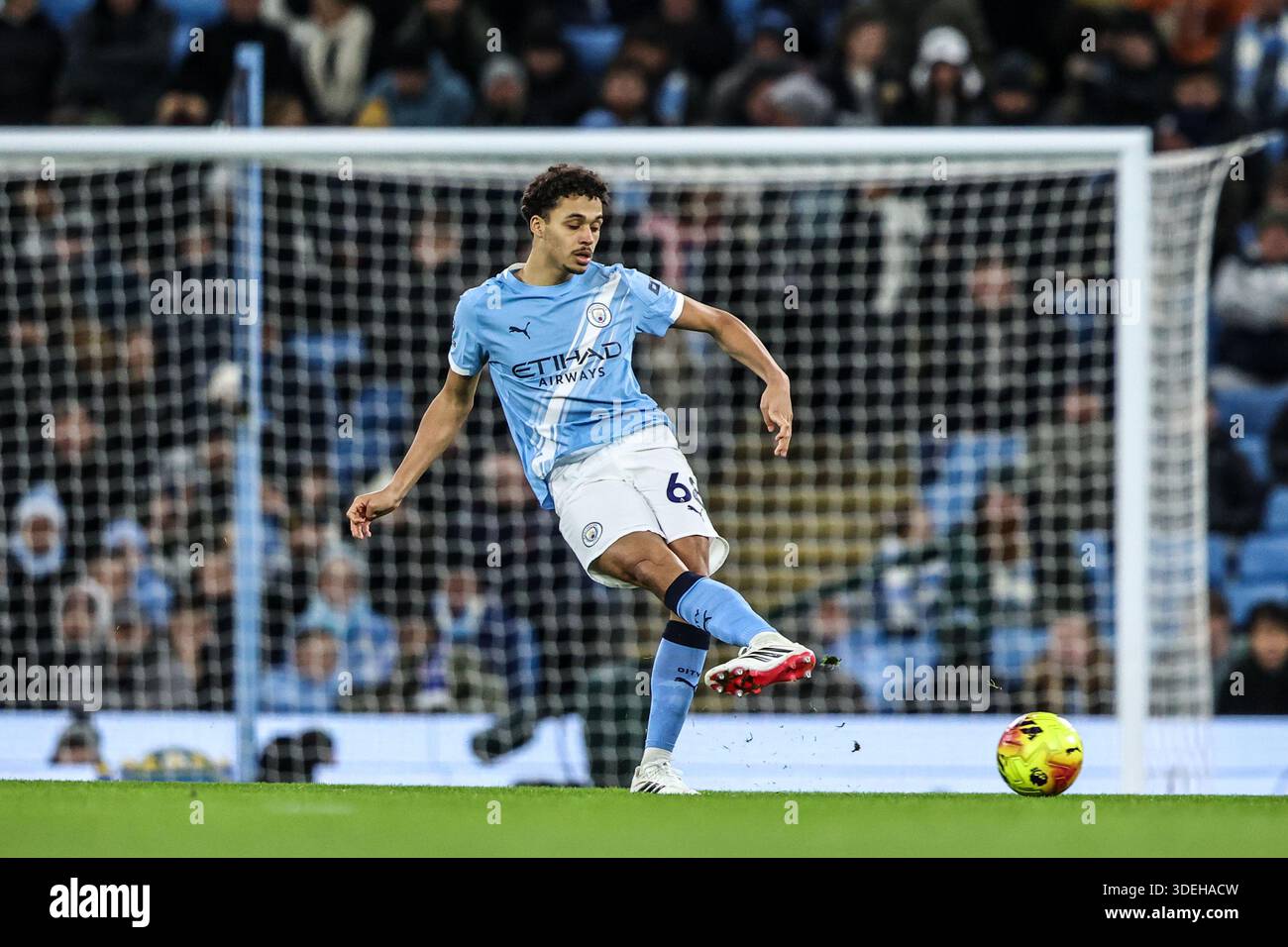 Max Alleyne of Manchester City passes the ball during the Premier ...
