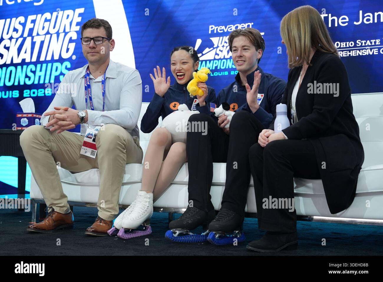 Chelsea Liu and Ryan Bedard watch for results with their coaches after ...