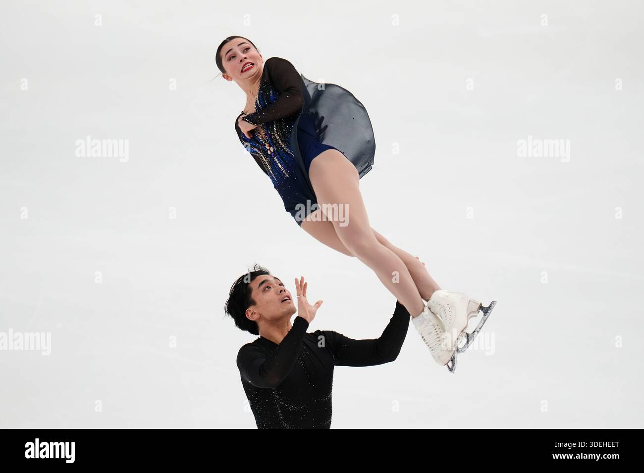Olivia Flores and Luke Wang compete during the pairs short program at ...