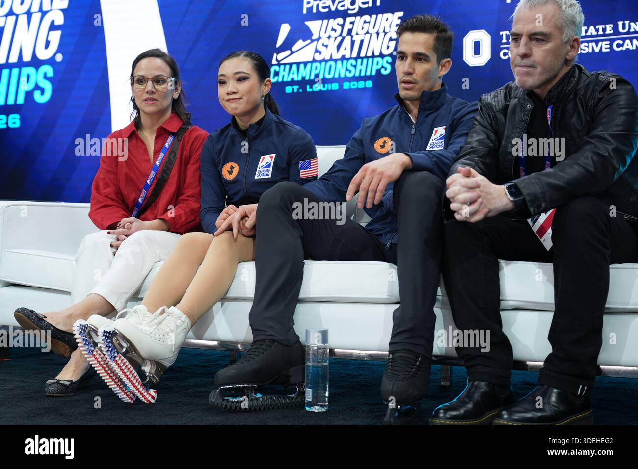 Audrey Shin and Balazs Nagy watch for results after competing during ...