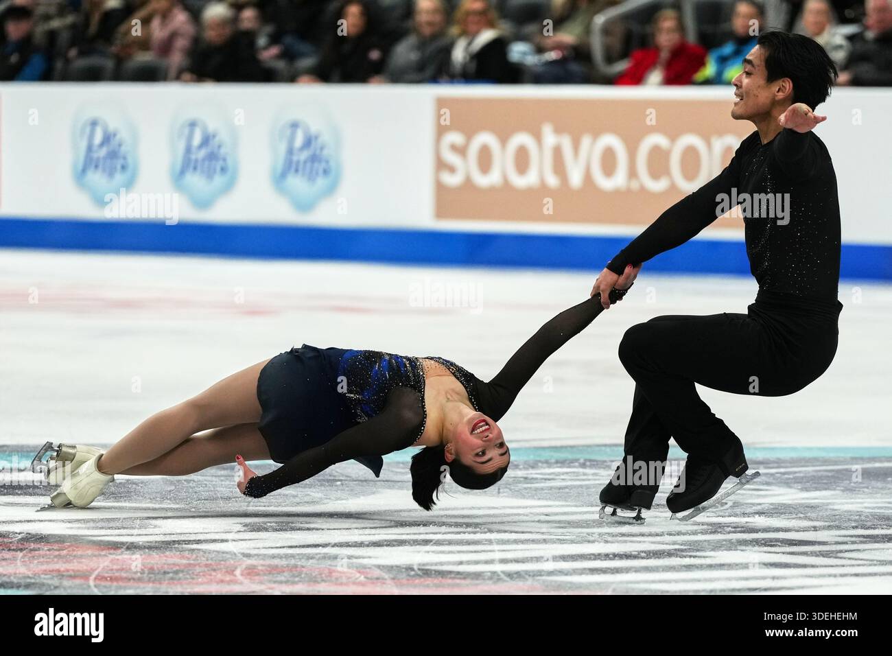 Olivia Flores and Luke Wang compete during the pairs short program at ...