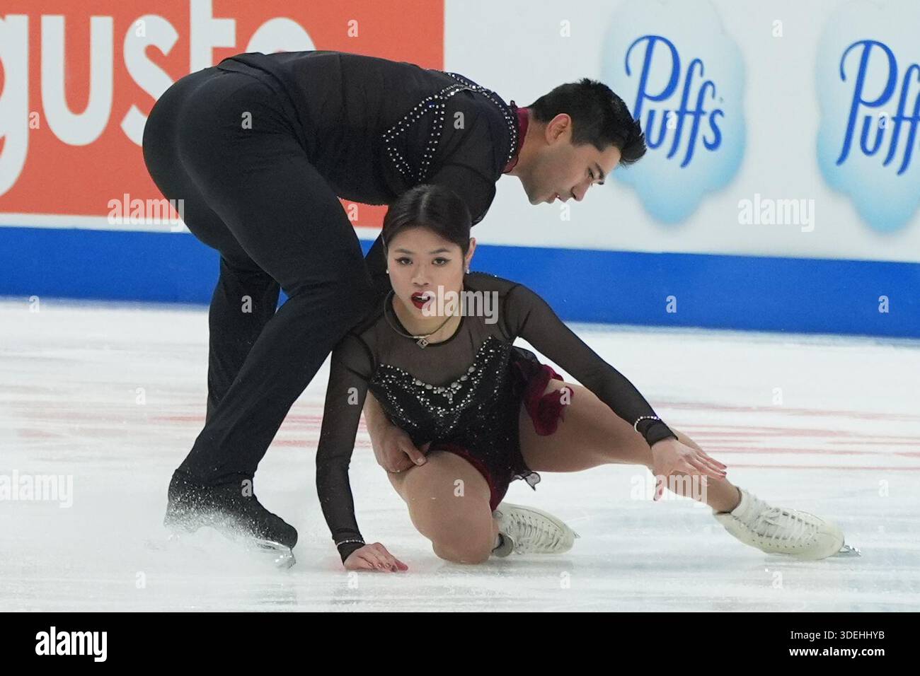 Emily Chan and Spencer Akira Howe fall while competing during the pairs ...