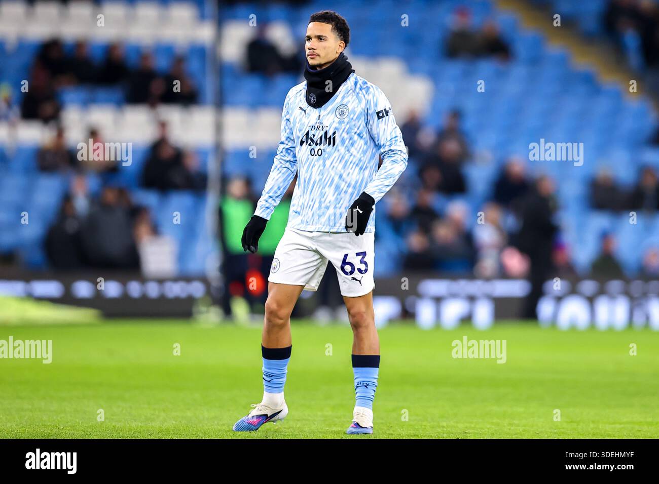 Divine Mukasa of Manchester City warms up before the Manchester City v ...
