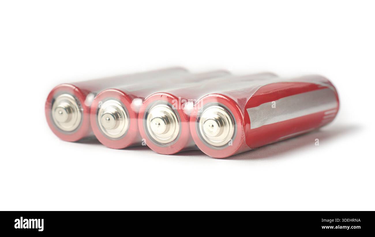 four red and silver metal batteries in transparent plastic wrap ...